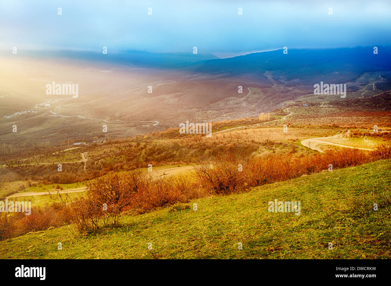 Rural landscape with sun rays Stock Photo - Alamy