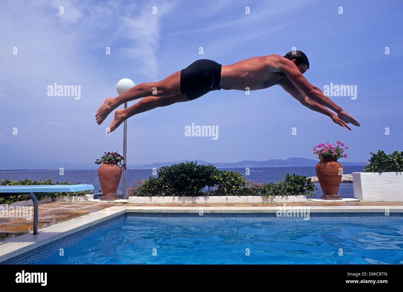 Man male diving into holiday swimming pool Escala Spain 1997 Stock ...
