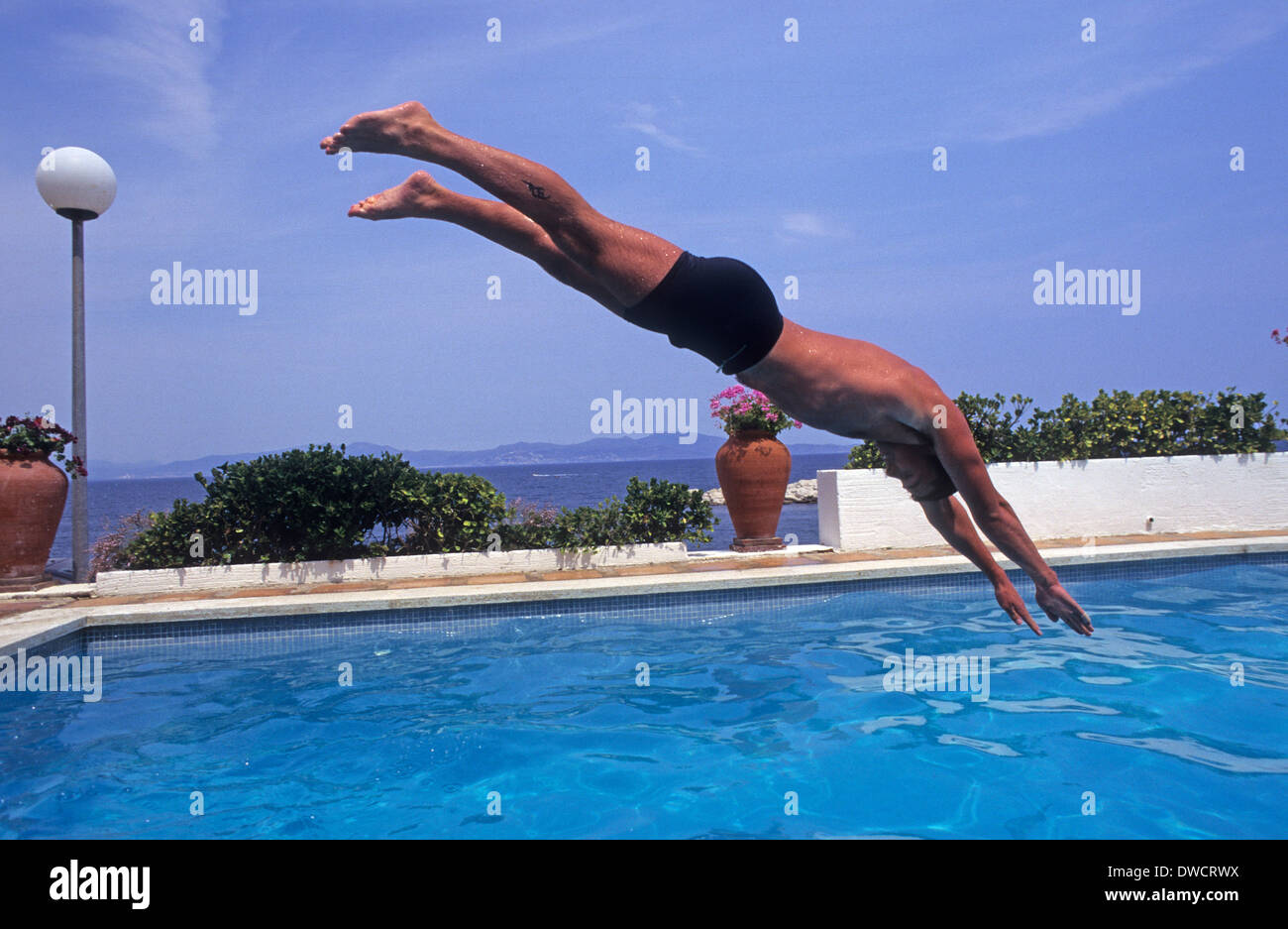 Teenager male swimming pool hi-res stock photography and images - Alamy