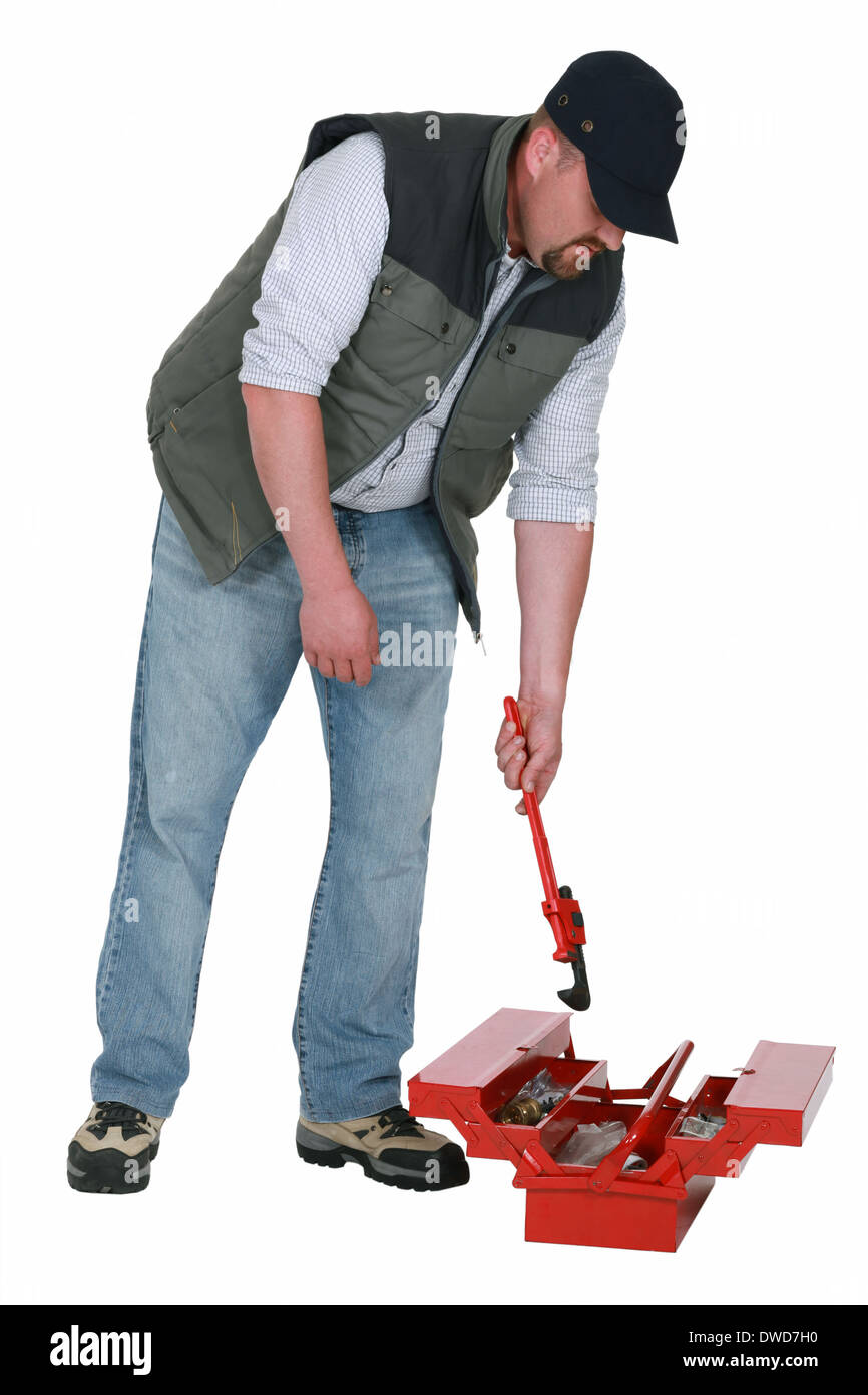 Worker getting a wrench Stock Photo - Alamy
