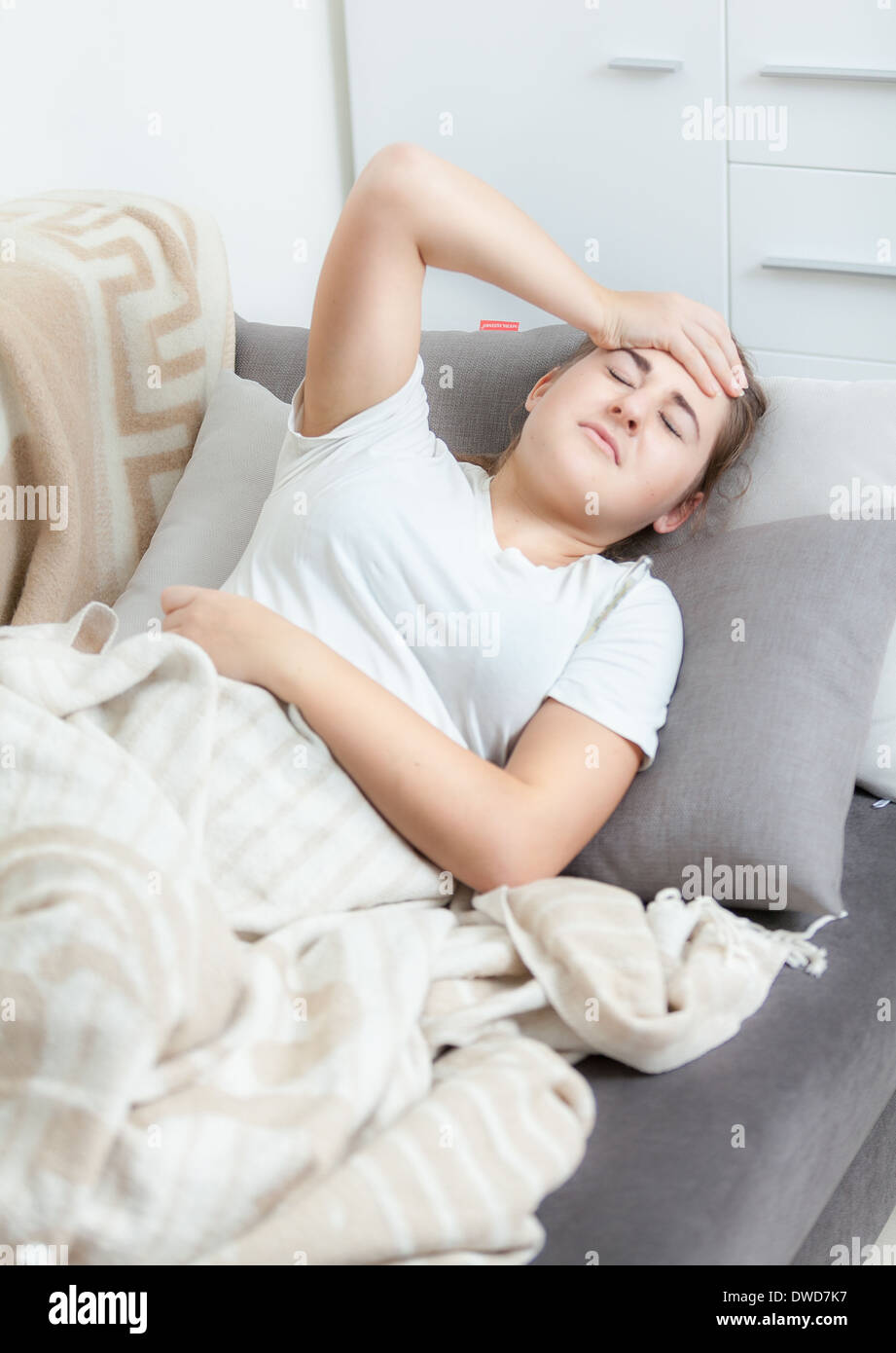 Sick woman taking temperature Stock Photo - Alamy