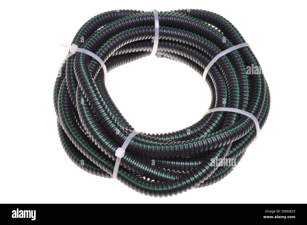 Corrugated pipe for electrical cables coiled in a circle isolated on ...