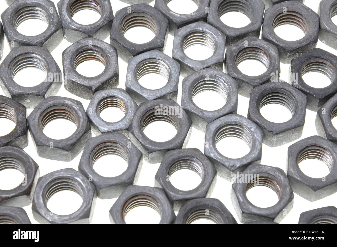 Hardware threaded nuts on white background Stock Photo - Alamy