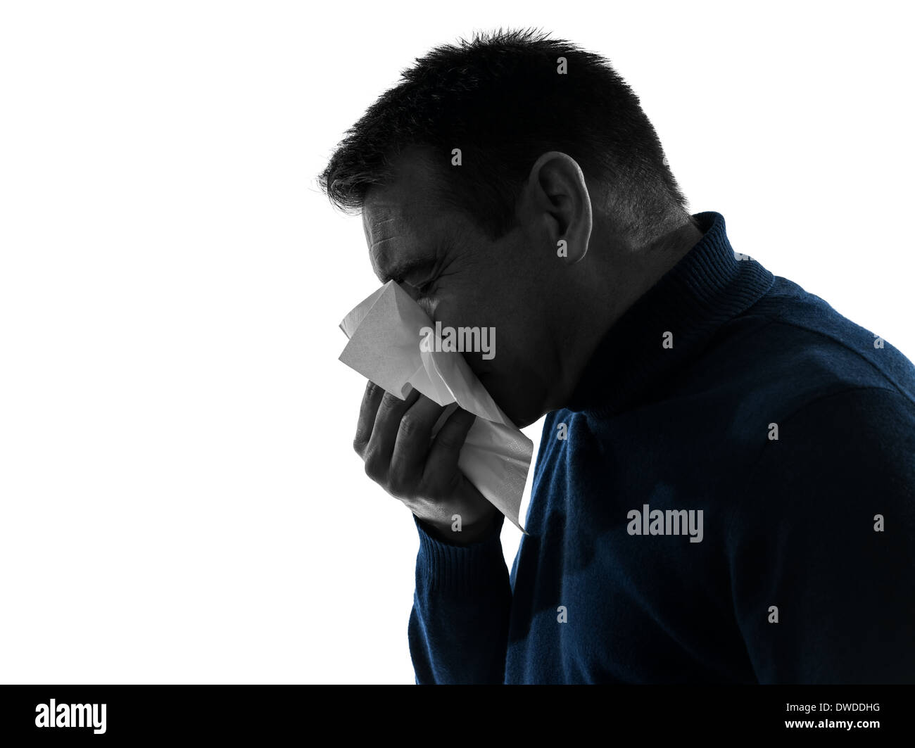 one man sneezing portrait in silhouette studio isolated on white ...