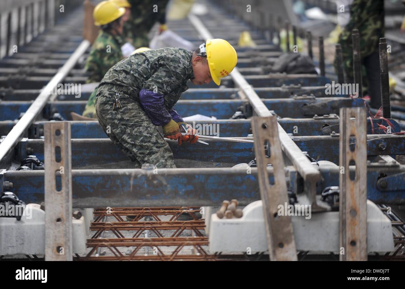 Chengdu, China's Sichuan province. 5th Mar, 2014. Workers work at the ...