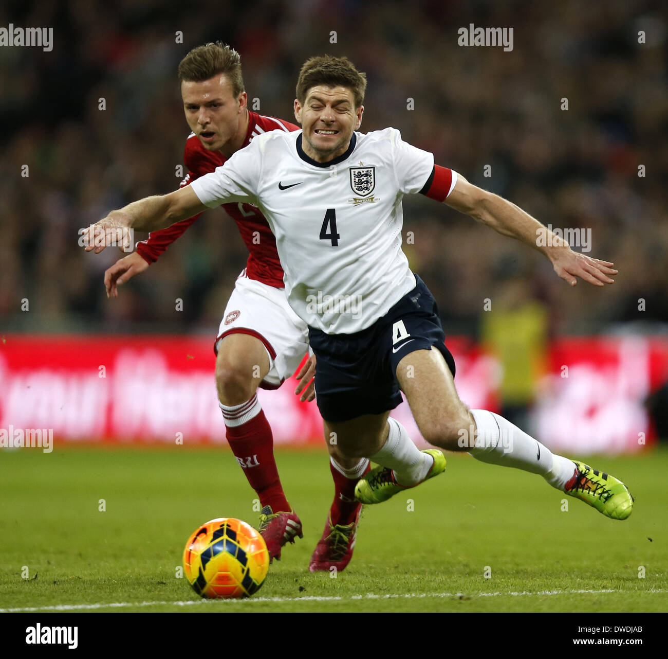 London, UK. 5th Mar, 2014. Steven Gerrard(R) of England is tackled by ...