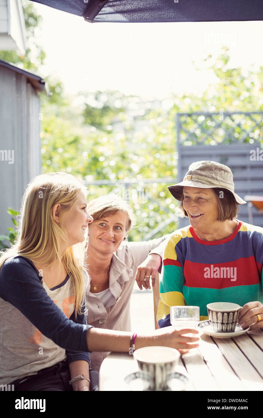 Women sitting with cups and saucers hi-res stock photography and images ...