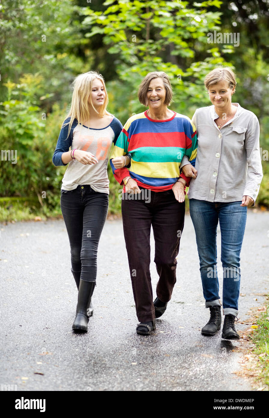 Three generation females walking on street Stock Photo - Alamy