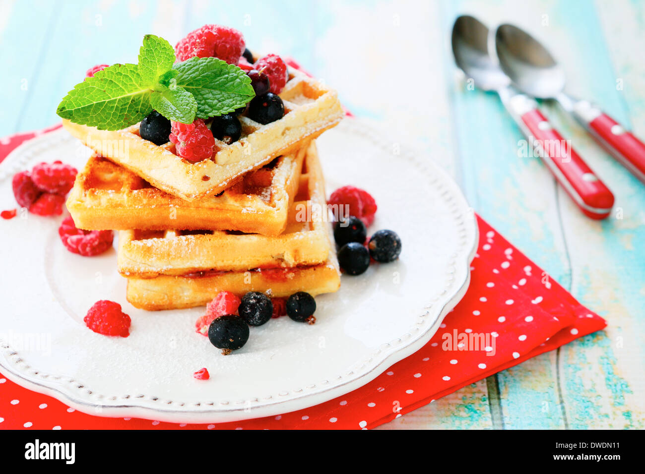 square sweet waffles with berries, food closeup Stock Photo - Alamy