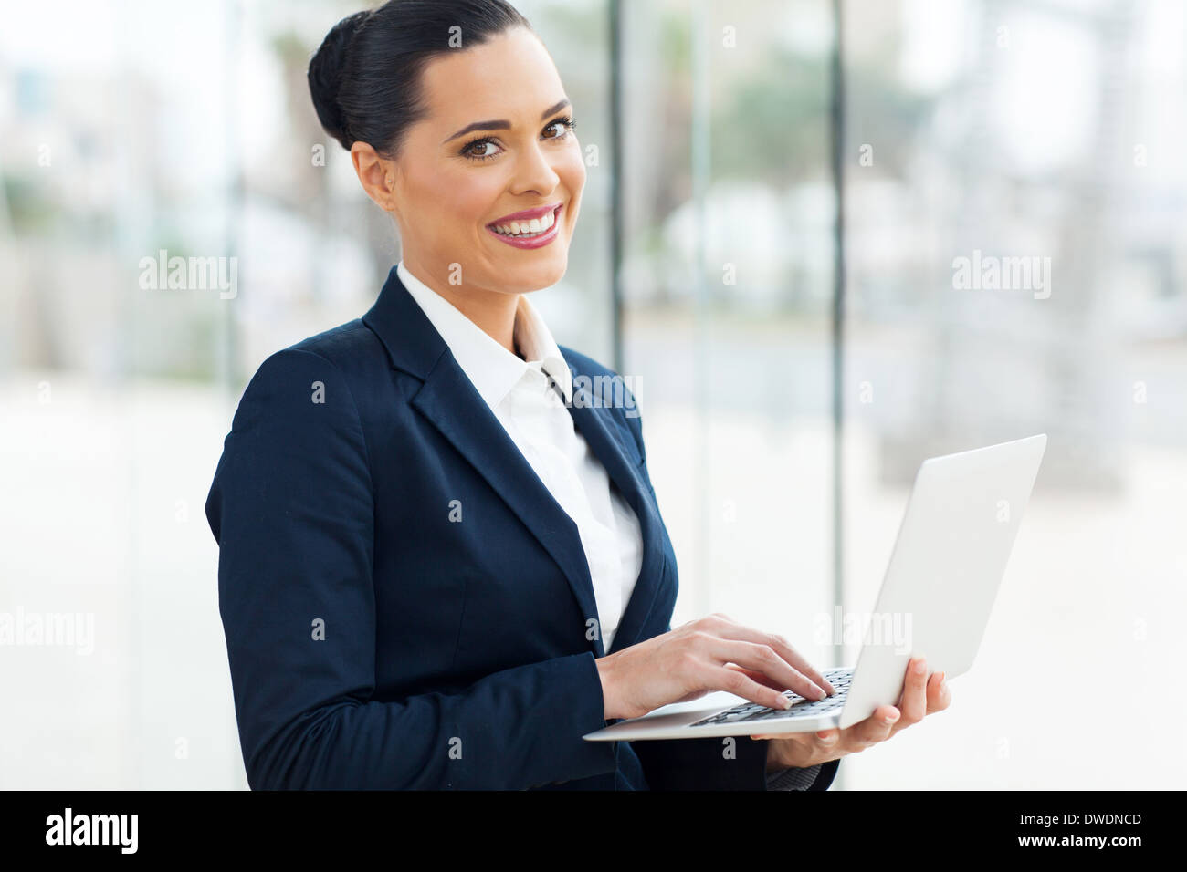 beautiful business executive using laptop in office Stock Photo - Alamy