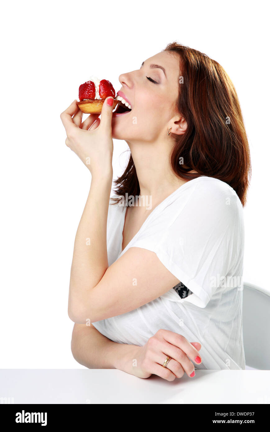 Woman eating fresh strawberry cake isolated on a white background Stock ...