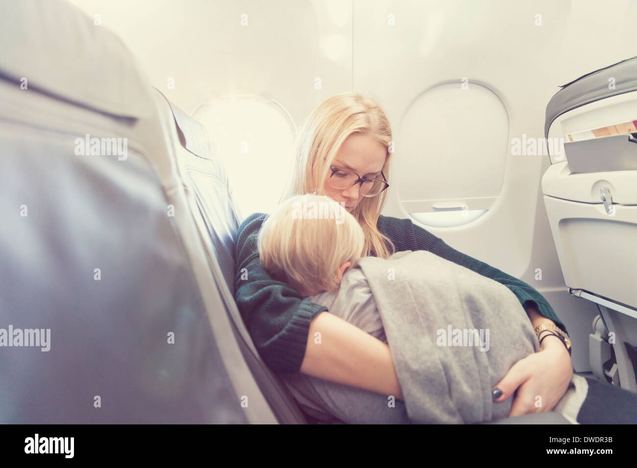 Mother with son in airplane Stock Photo - Alamy