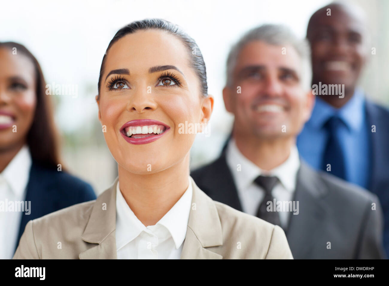 group of multiracial business people looking up Stock Photo - Alamy