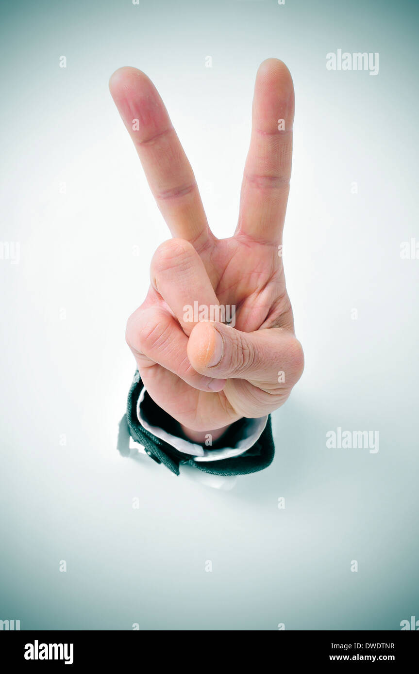 man hand giving the V sign as symbol of success Stock Photo - Alamy