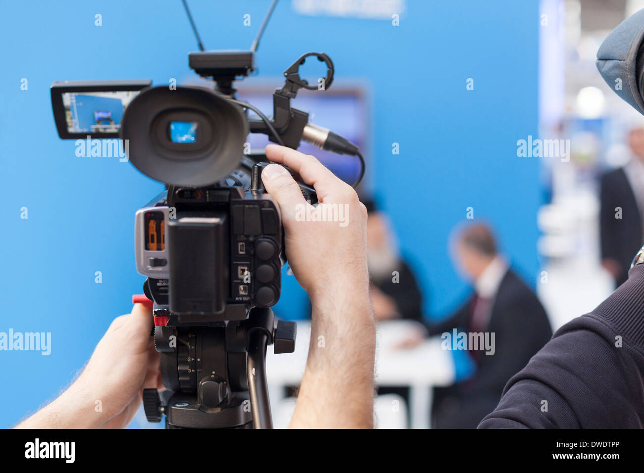 capturing event with professional video camera Stock Photo - Alamy