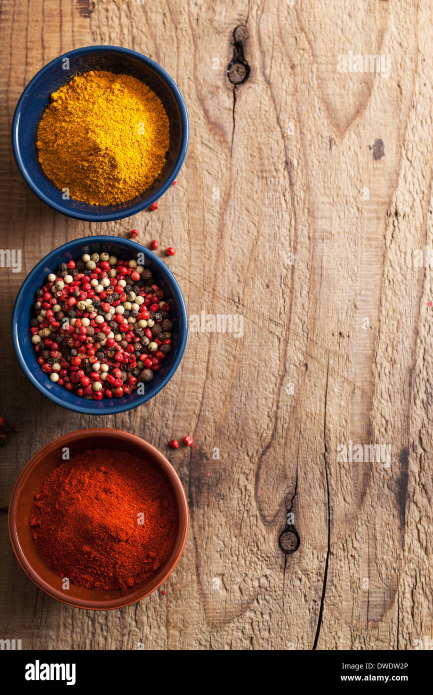 spices background: pink and black pepper, paprika powder, curry Stock ...