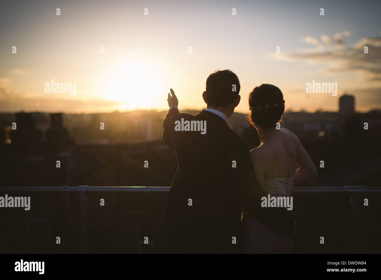 Couple look at sunset hi-res stock photography and images - Alamy