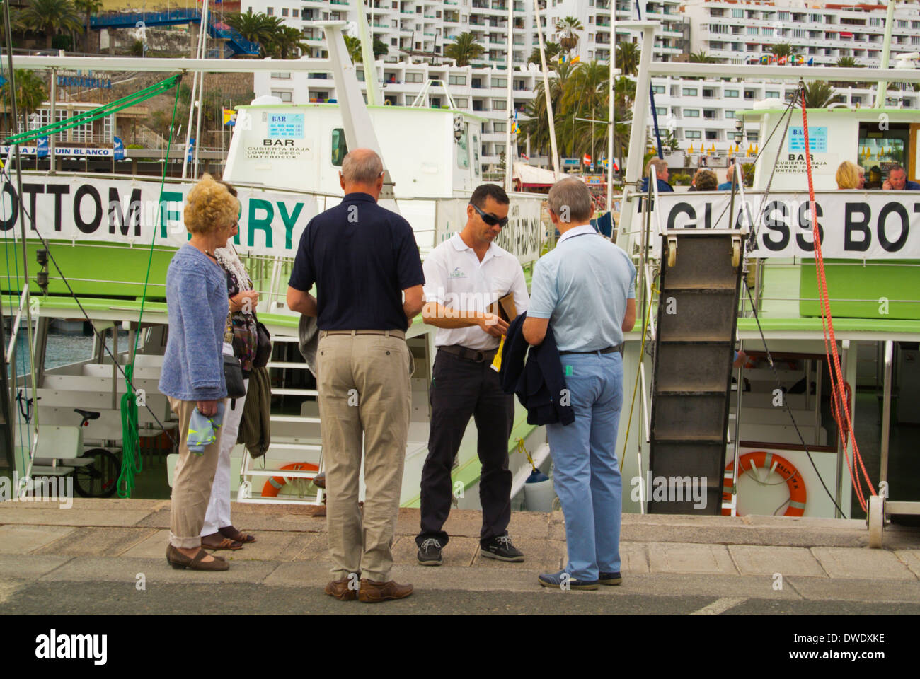 People getting on glass bottomed boats for a cruise, Puerto the port ...