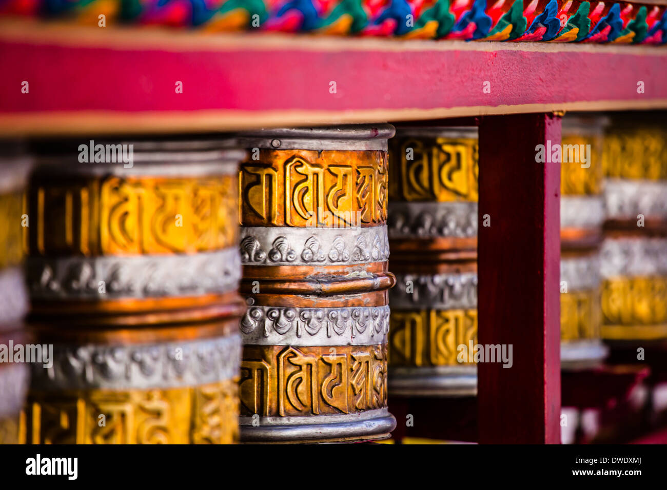 Buddhist prayer wheels in Tibetan monastery with written mantra. India ...