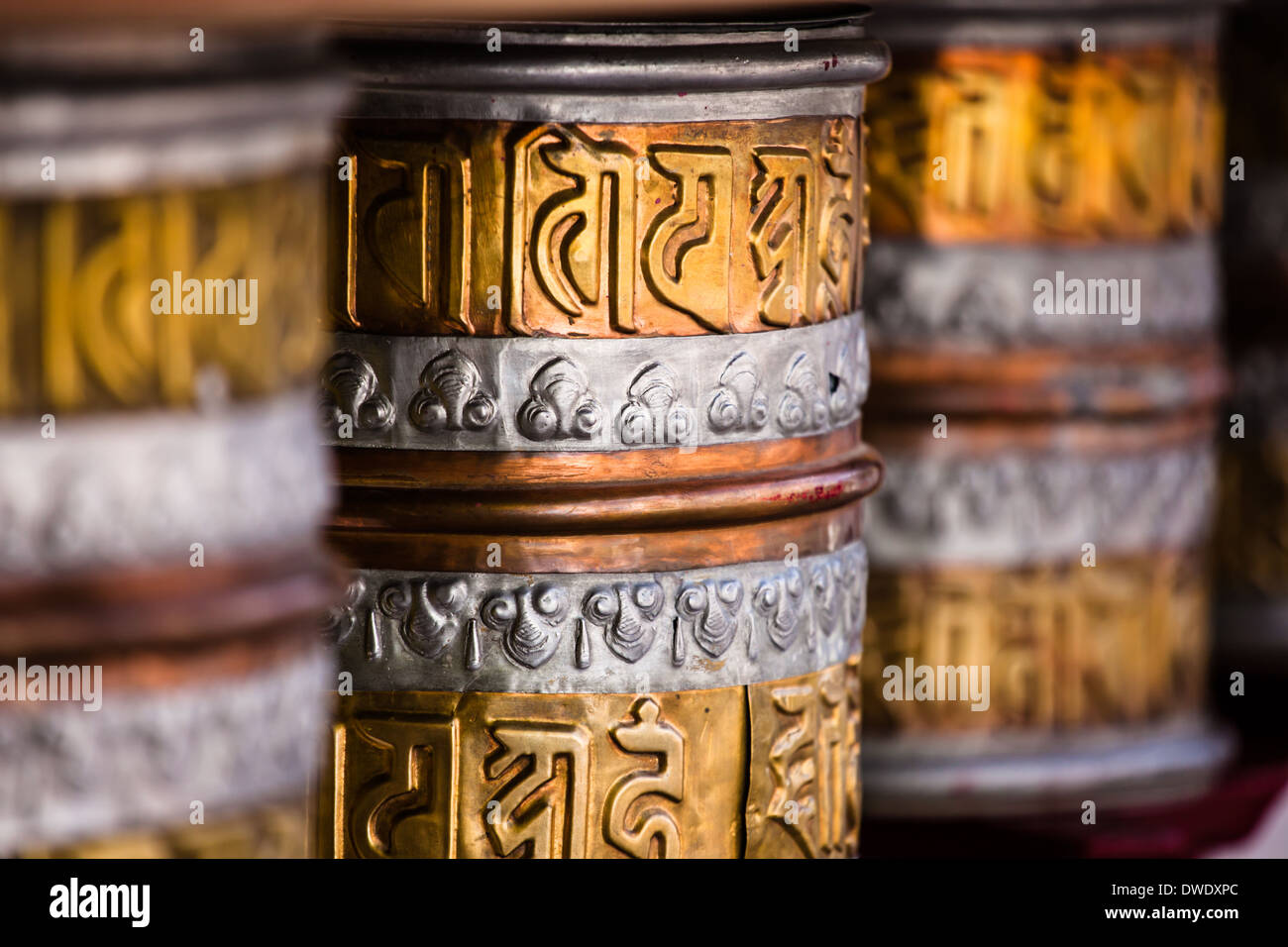 Buddhist prayer wheels in Tibetan monastery with written mantra. India ...