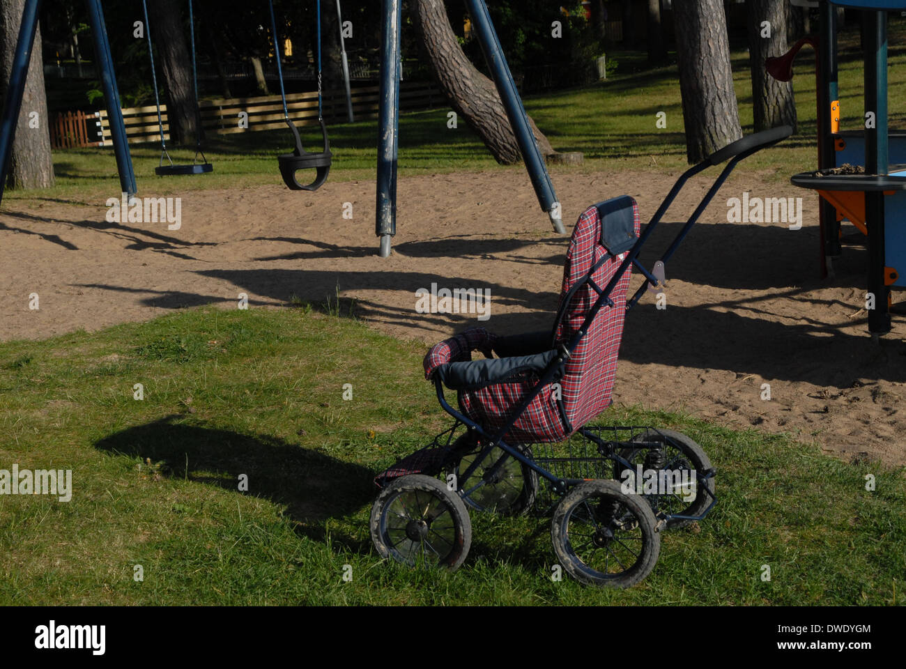 Pushchair in playground Stock Photo - Alamy