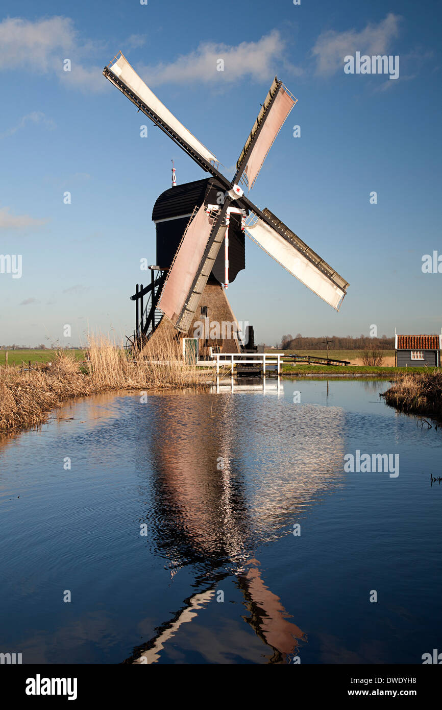 In water mirrored windmill "Broekmolen", Streefkerk, Alblasserwaard ...