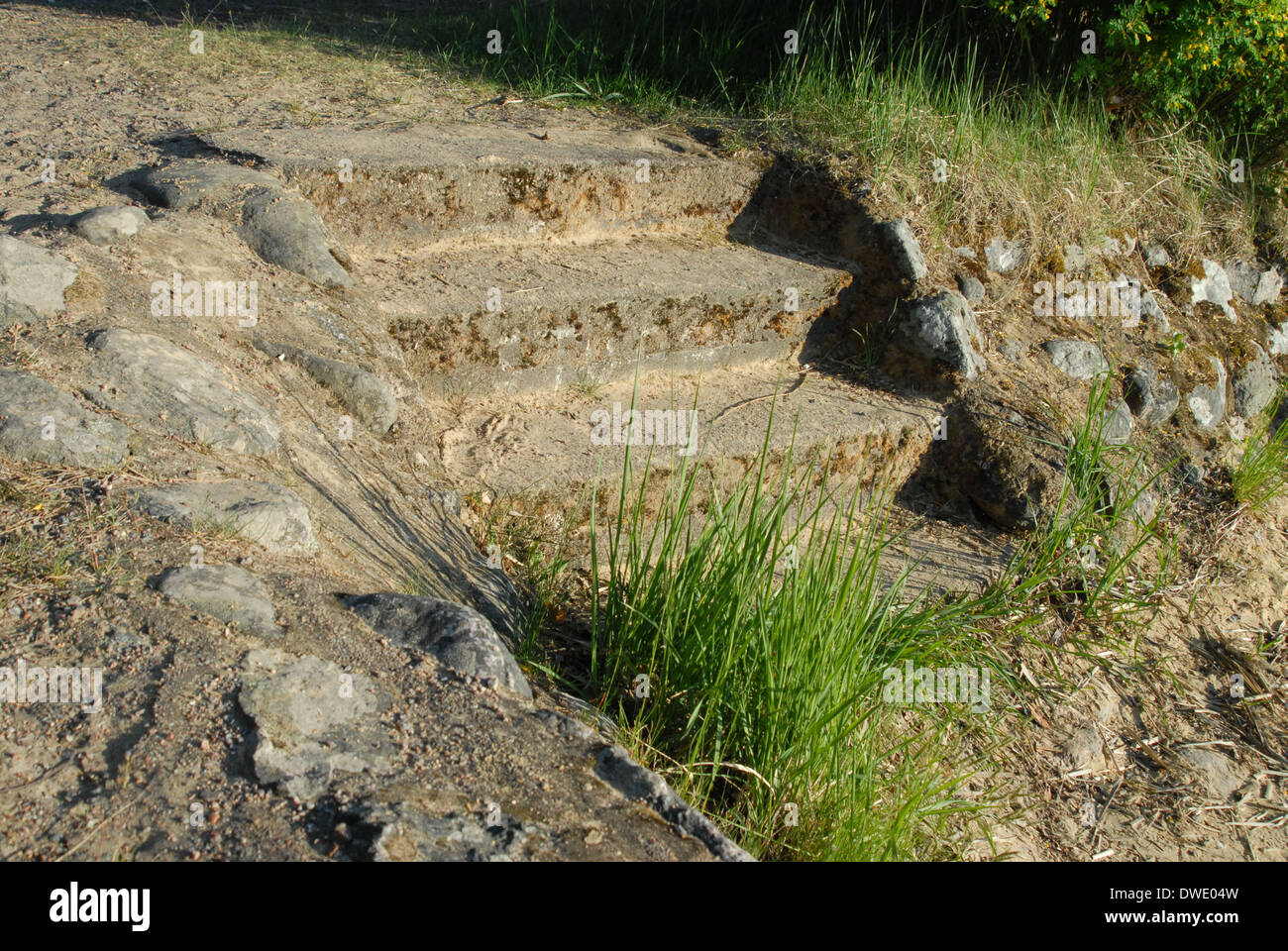 Steep angled stone steps on a beach Stock Photo - Alamy