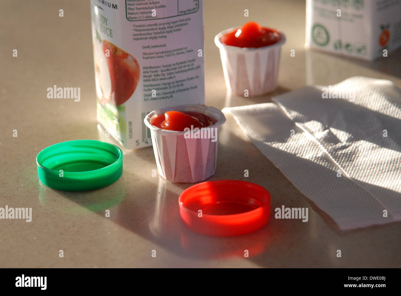 Fast food condiment, ketchup in small single-use cups, containing ...