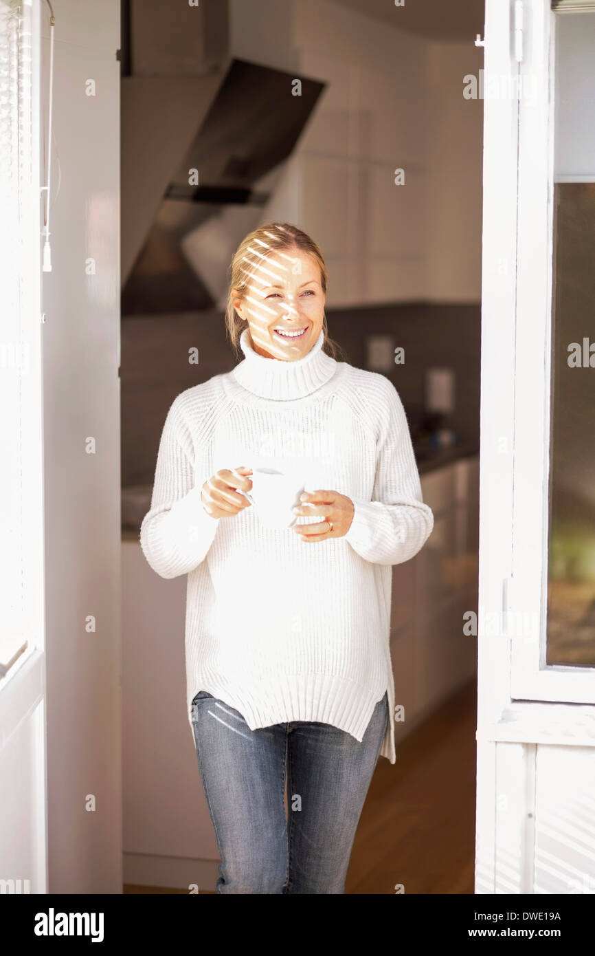 Woman exiting house hi-res stock photography and images - Alamy