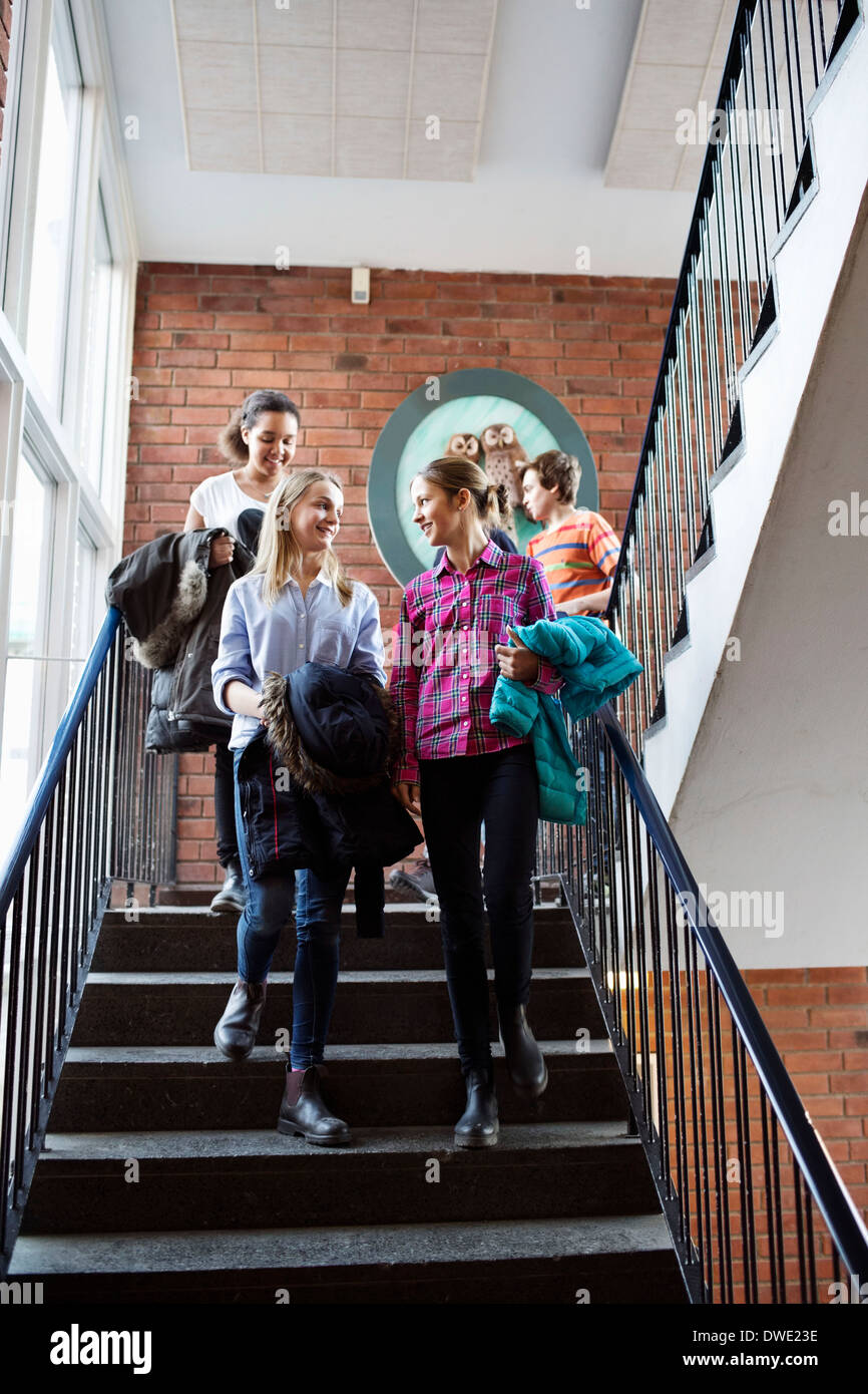 Students moving down stairs in high school Stock Photo - Alamy