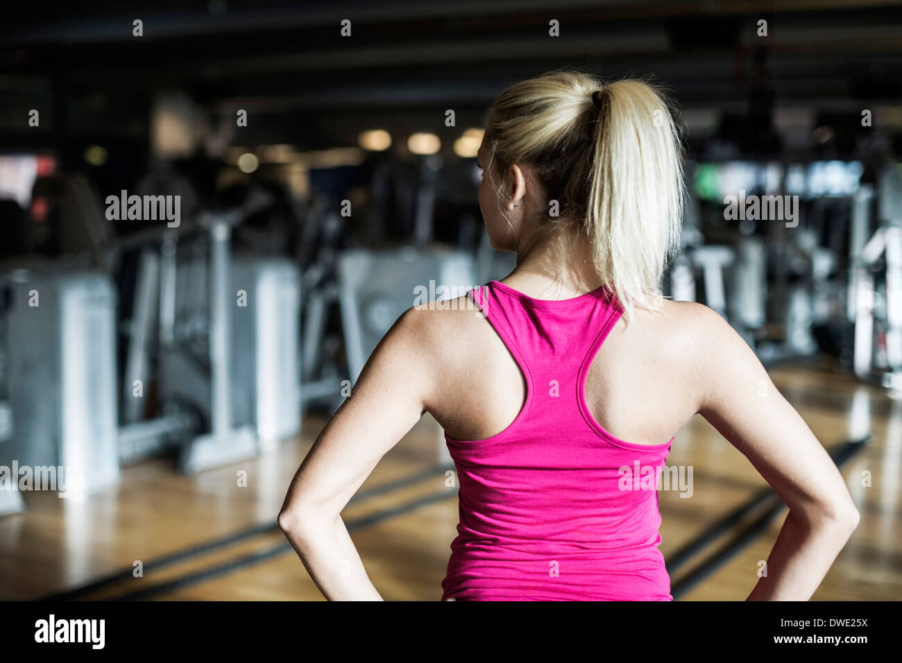 Rear view of fit young woman at gym Stock Photo - Alamy