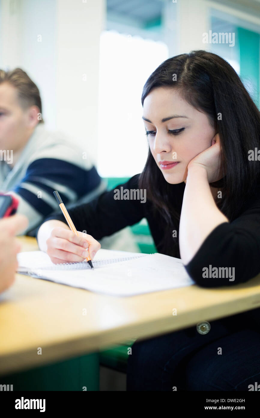 Female student studying in common room at college Stock Photo - Alamy