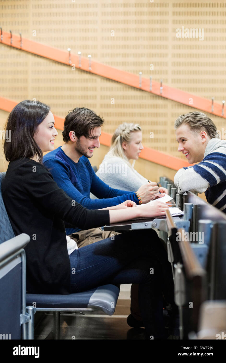 University students conversing in classroom Stock Photo - Alamy
