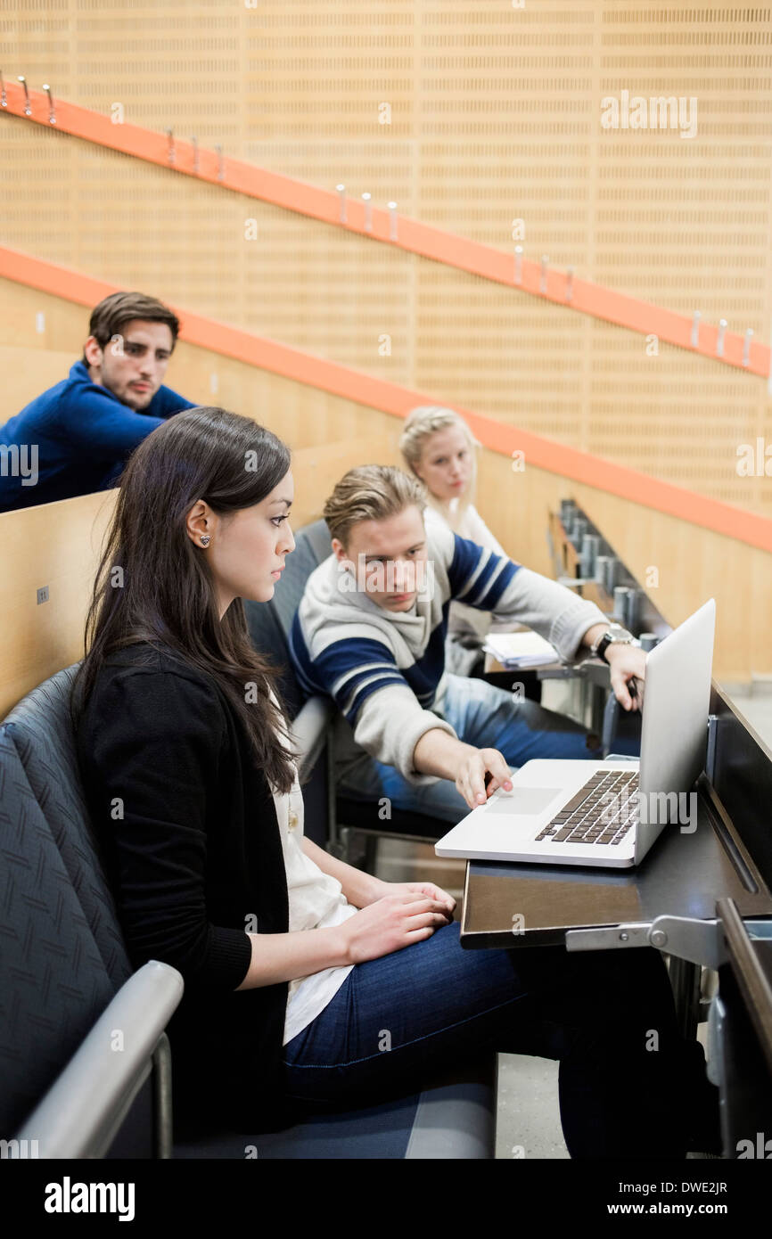 University students using laptop in classroom Stock Photo - Alamy