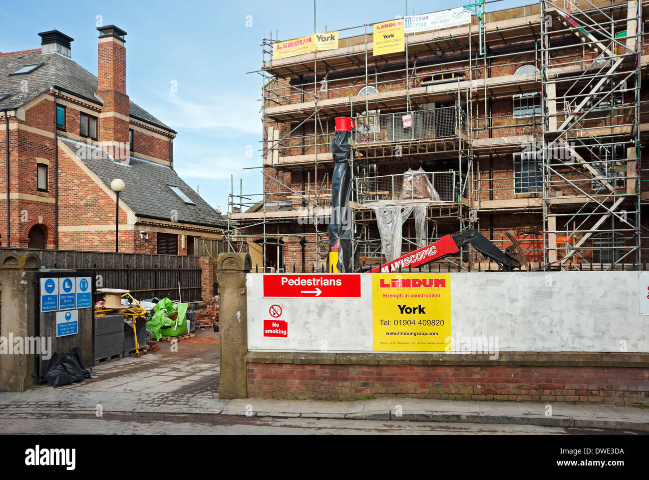 Building construction site entrance of former warehouse conversion to ...