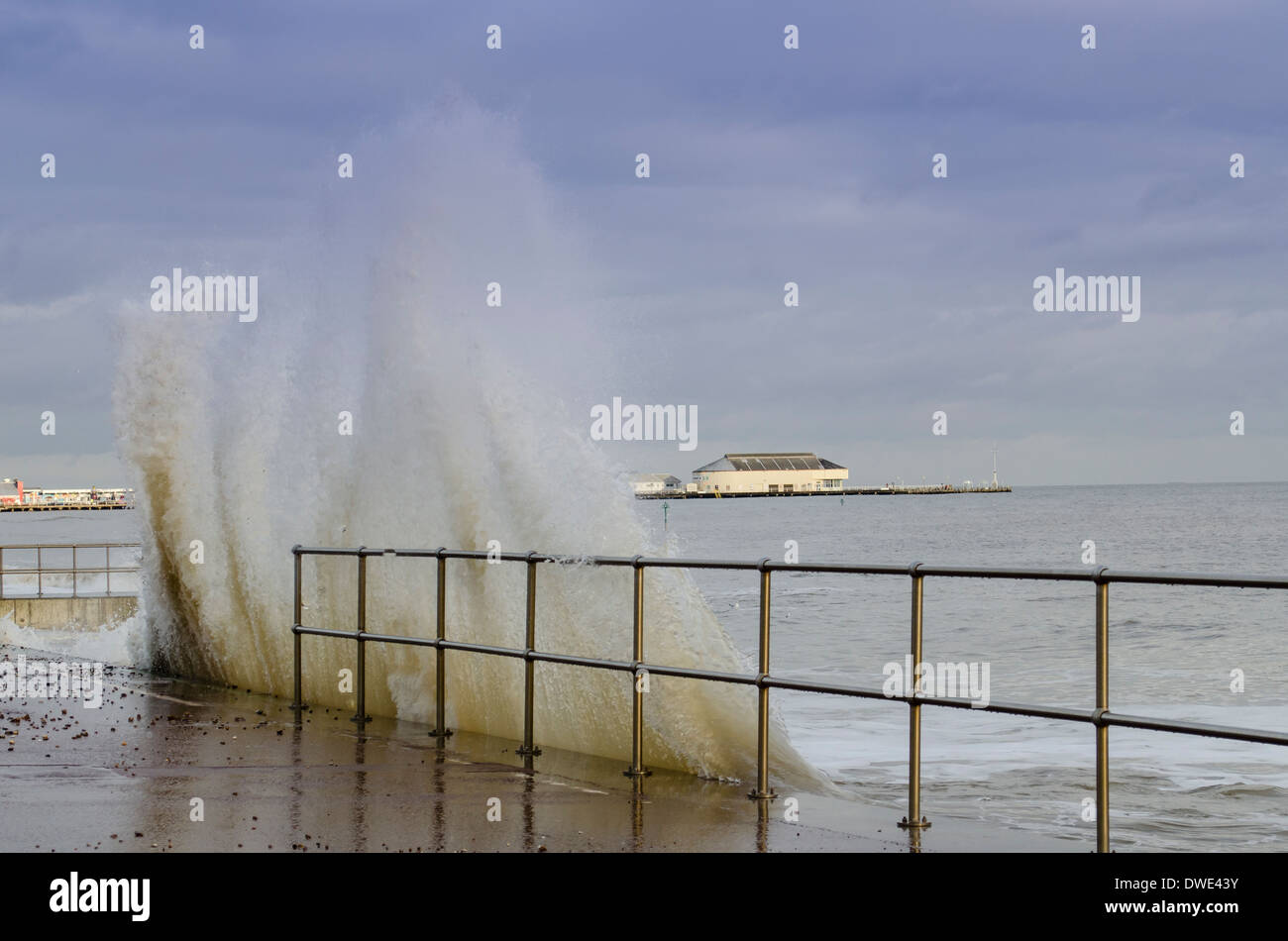 Waves hitting a sea wall Stock Photo - Alamy