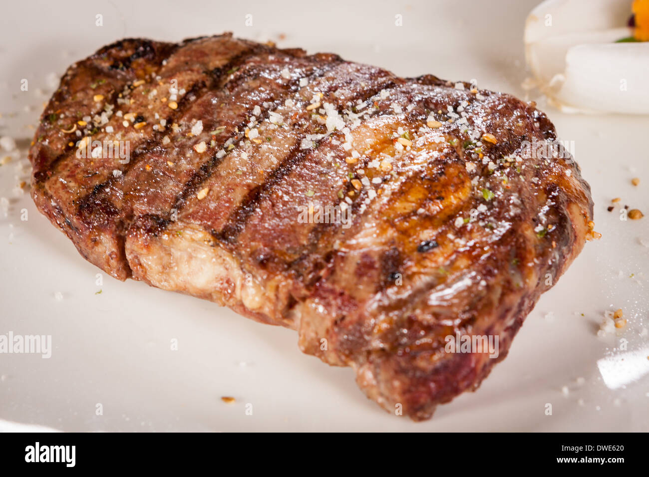 Delicious trimmed lean portion of thick grilled beef steak with ...