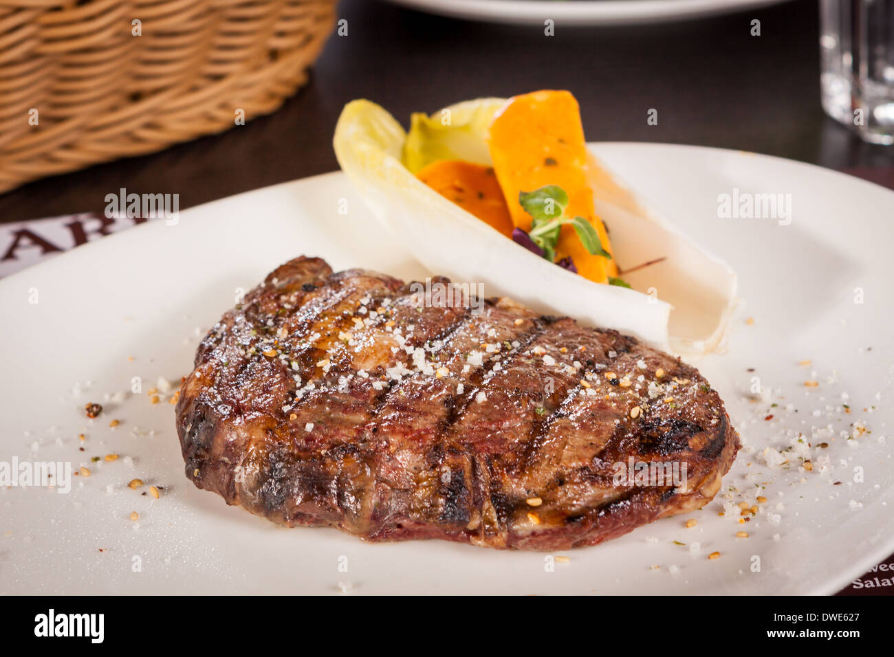 Delicious trimmed lean portion of thick grilled beef steak with ...