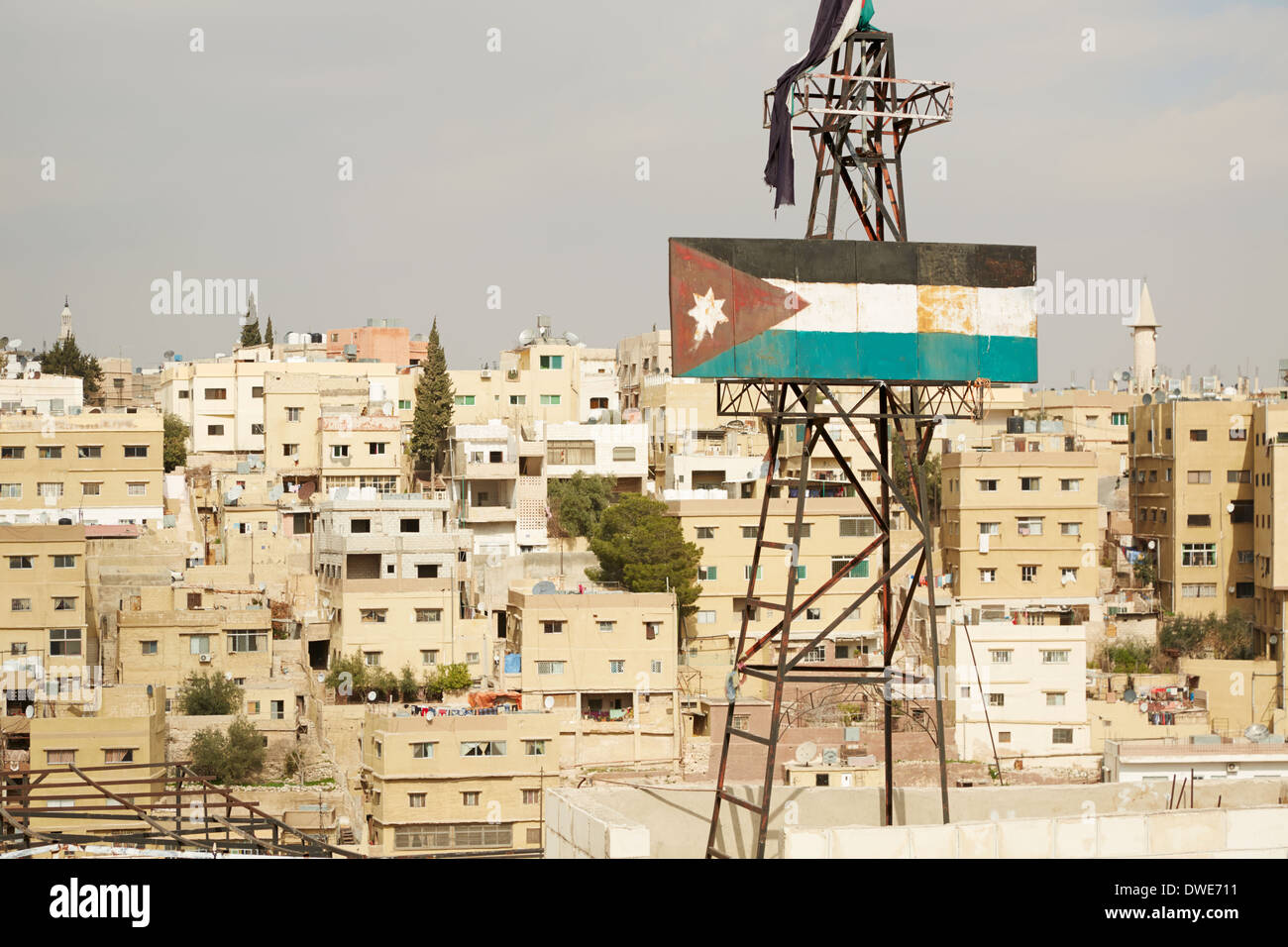 Rusty Jordan flag and Amman buildings view in Jordan Stock Photo - Alamy