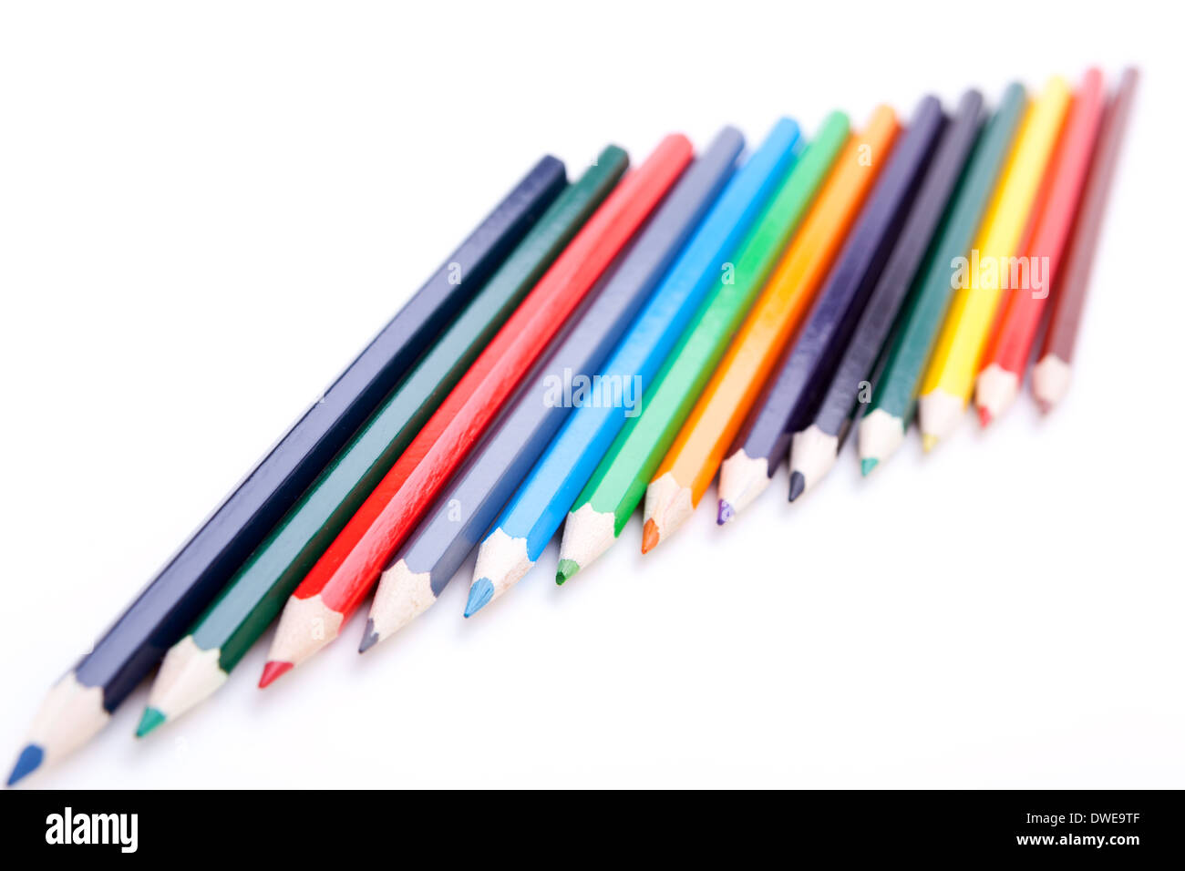 Bunch of sharpened wooden colourful pencil crayons in the colours of ...