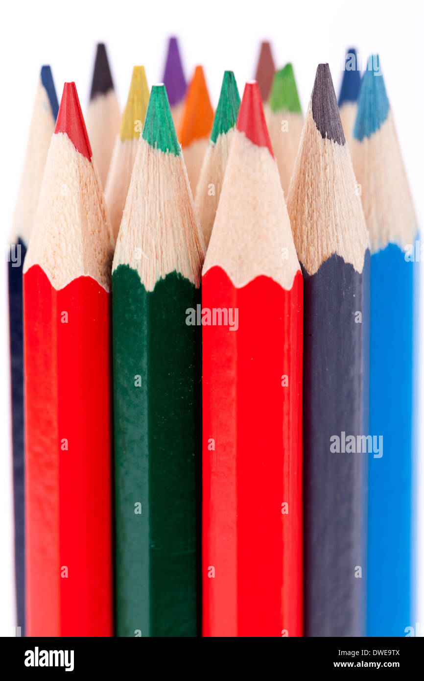 Bunch of sharpened wooden colourful pencil crayons in the colours of ...