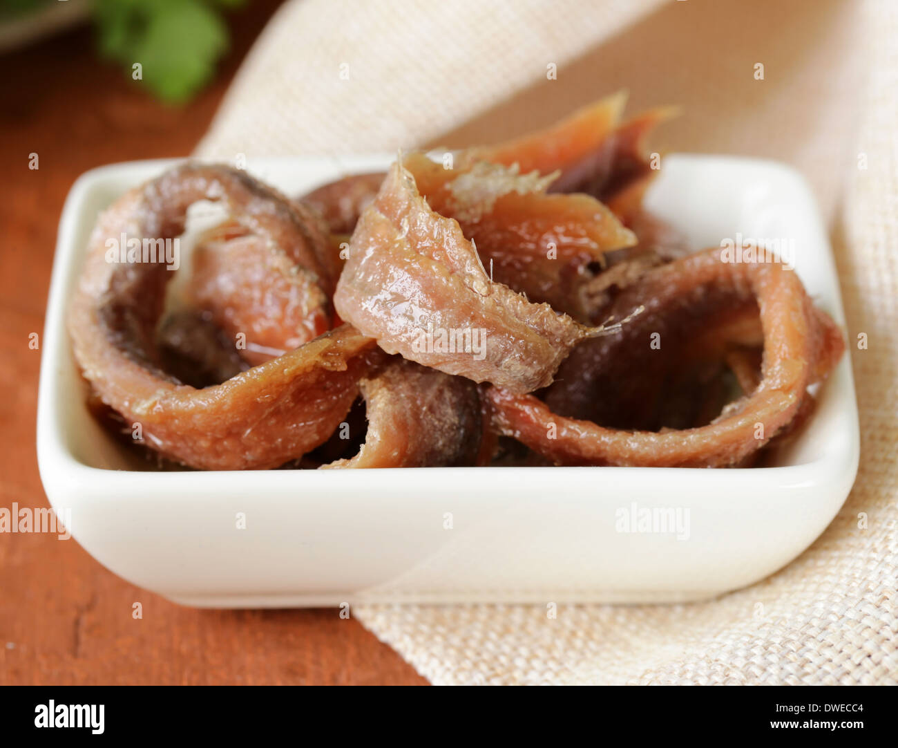 Canned marinated anchovies fillets in a white bowl Stock Photo - Alamy