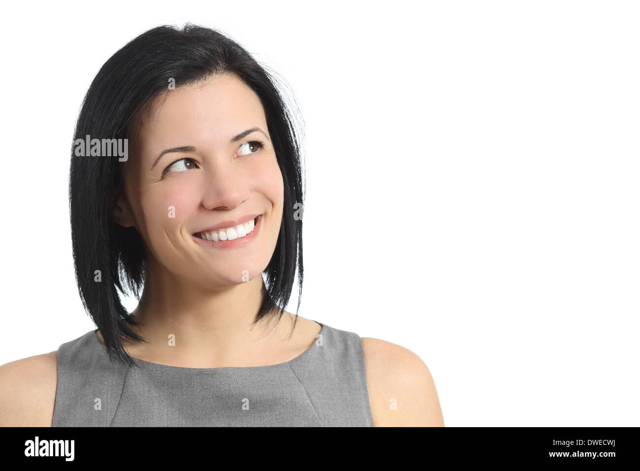 Portrait of a happy smiling woman looking sideways isolated on a white ...