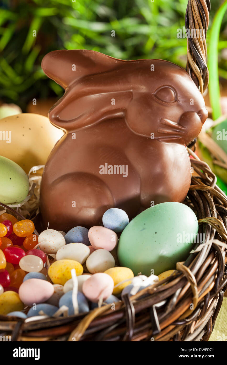 Chocolate Easter Bunny in a Basket with Assorted Candy Stock Photo - Alamy