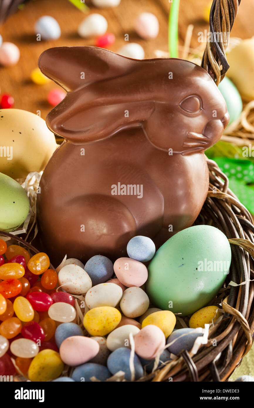 Chocolate Easter Bunny in a Basket with Assorted Candy Stock Photo - Alamy
