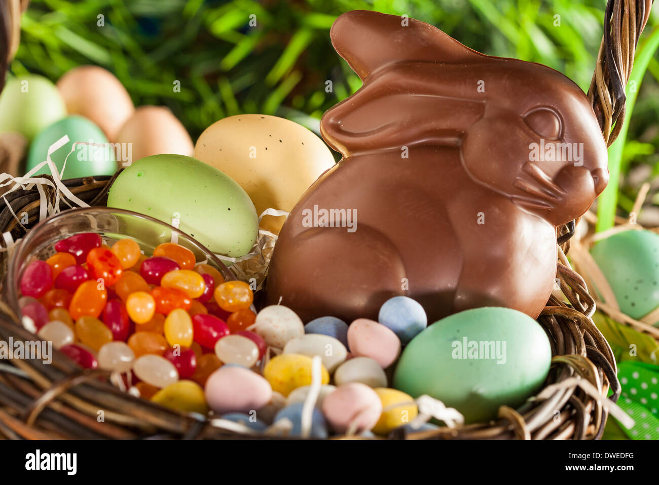 Chocolate Easter Bunny in a Basket with Assorted Candy Stock Photo - Alamy