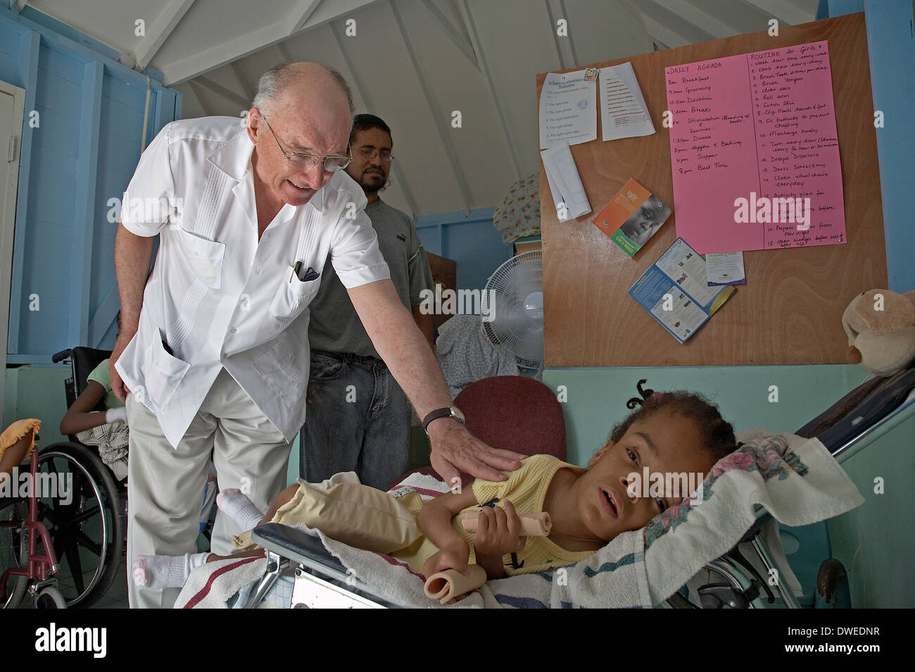 Jamaica American Catholic missionary priest visiting sick children ...