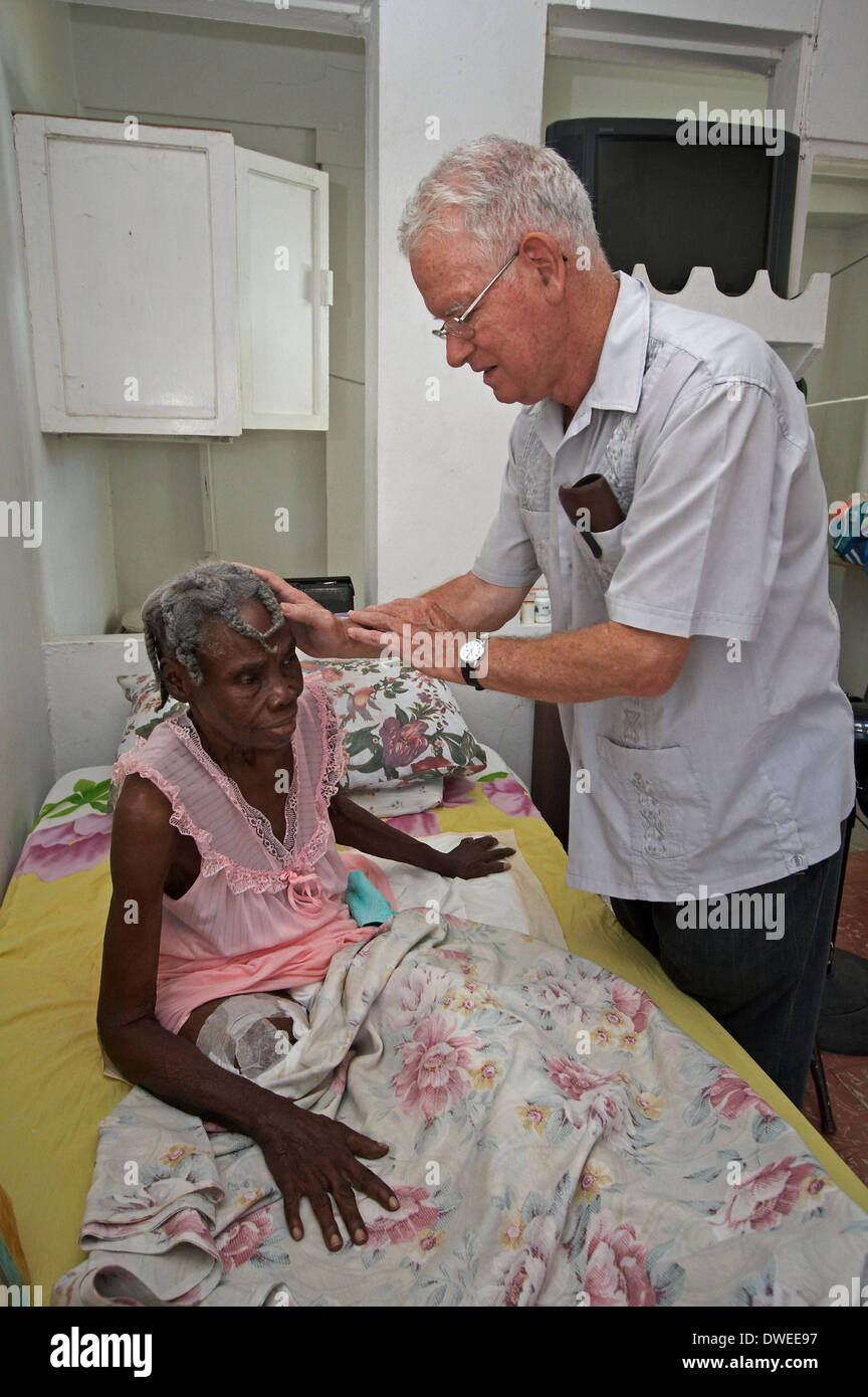 Jamaica American Catholic missionary priest visiting the sick Stock ...