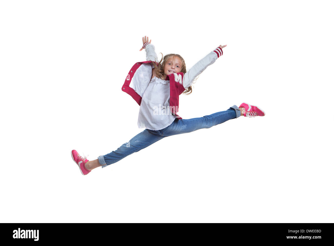 fit healthy young girl arms raised doing ballet leap or jump Stock ...