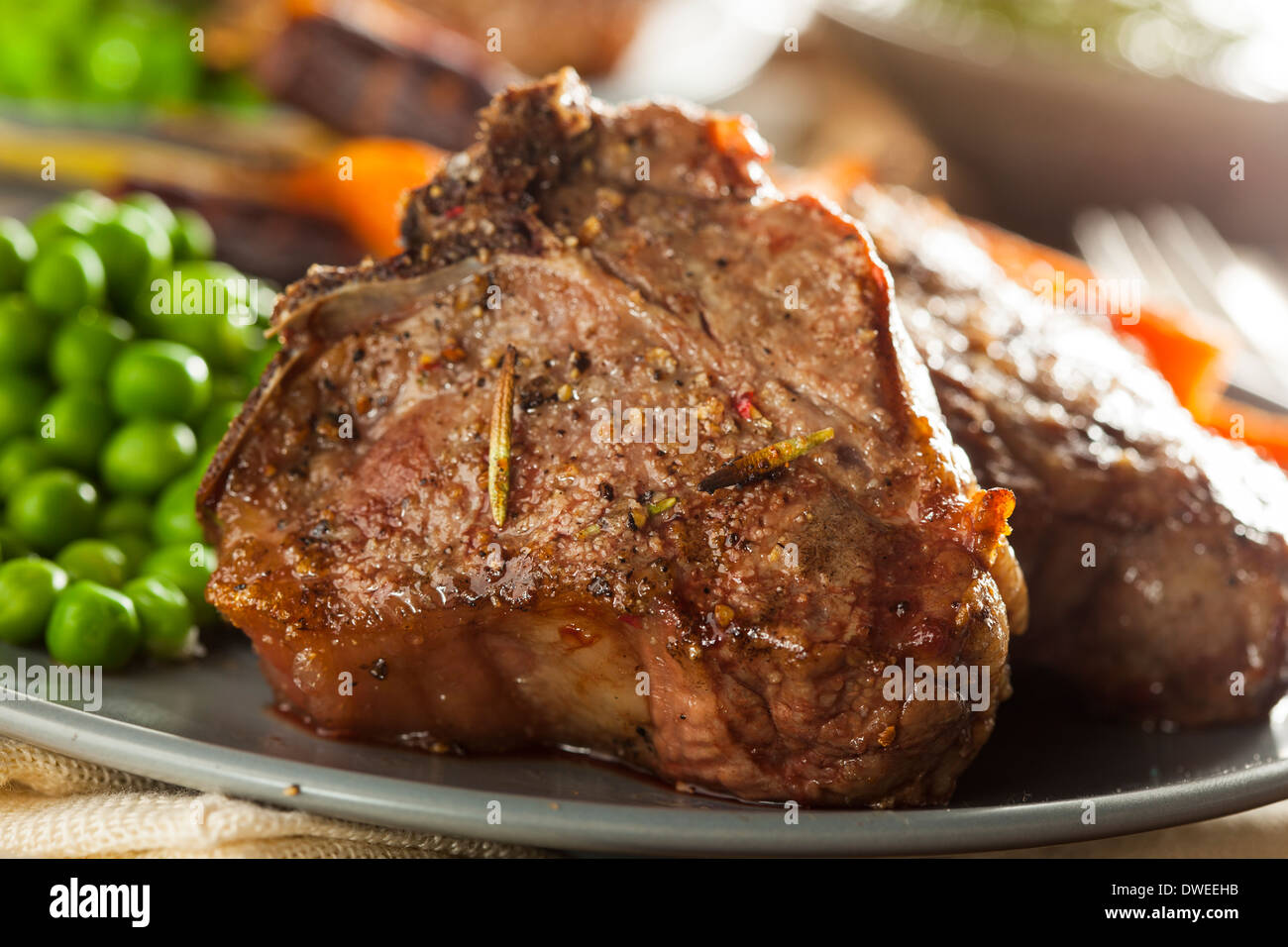 Homemade Cooked Lamb Chops with Peas and Carrots Stock Photo - Alamy